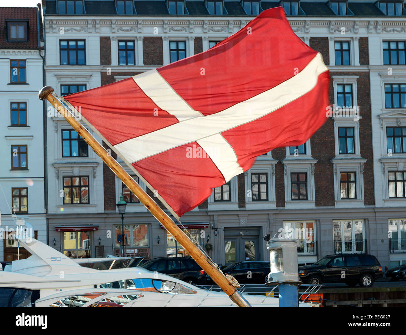 A Danish flag at a ship in Nyhavn, Copenhagen, Denmark in front of ...