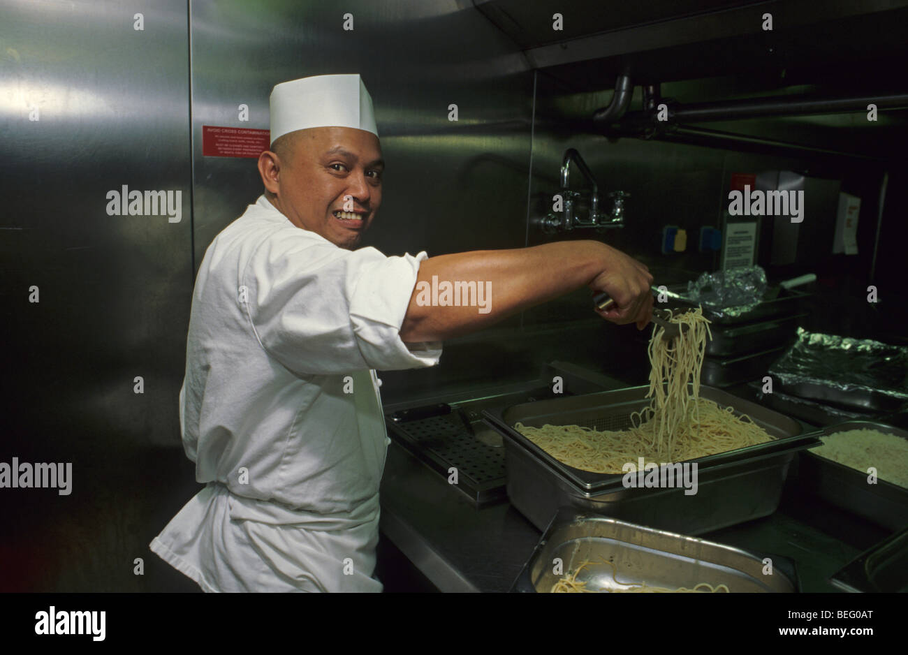 Filipino cook preparing spaghetti, cruise ship galley Stock Photo - Alamy