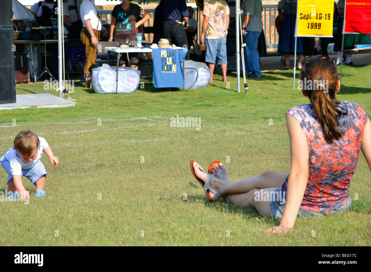 Mother with baby at concert Stock Photo - Alamy