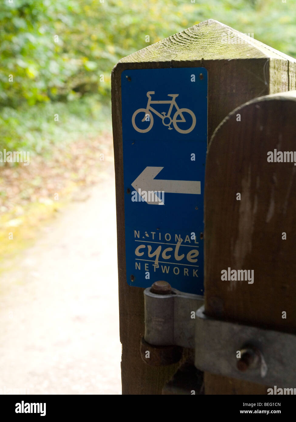 A blue National Cycle Network sign attached to a post on the Tissington ...