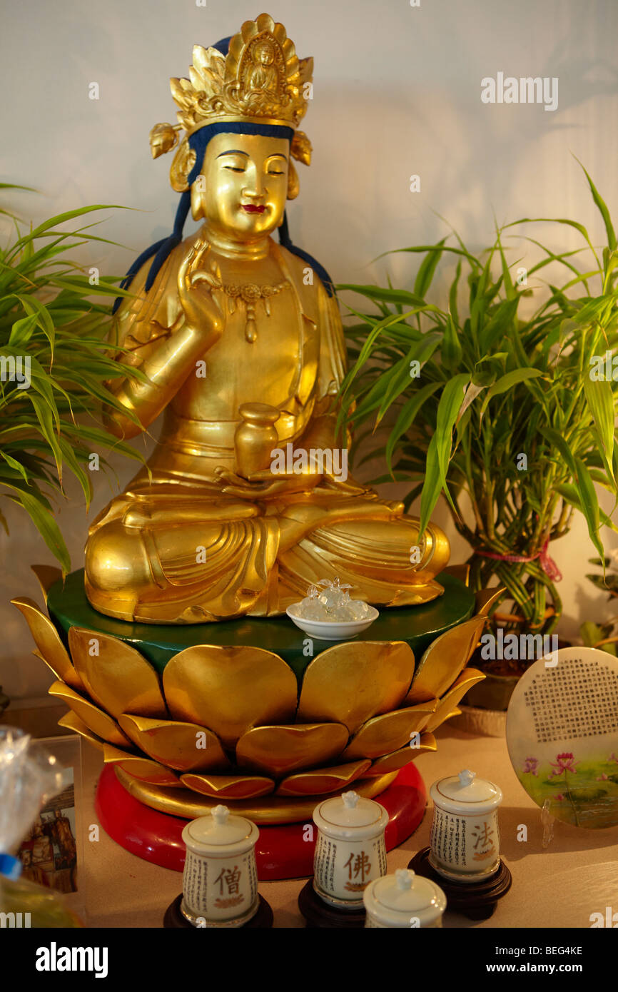 Buddha display in Chinese restaurant Stock Photo - Alamy