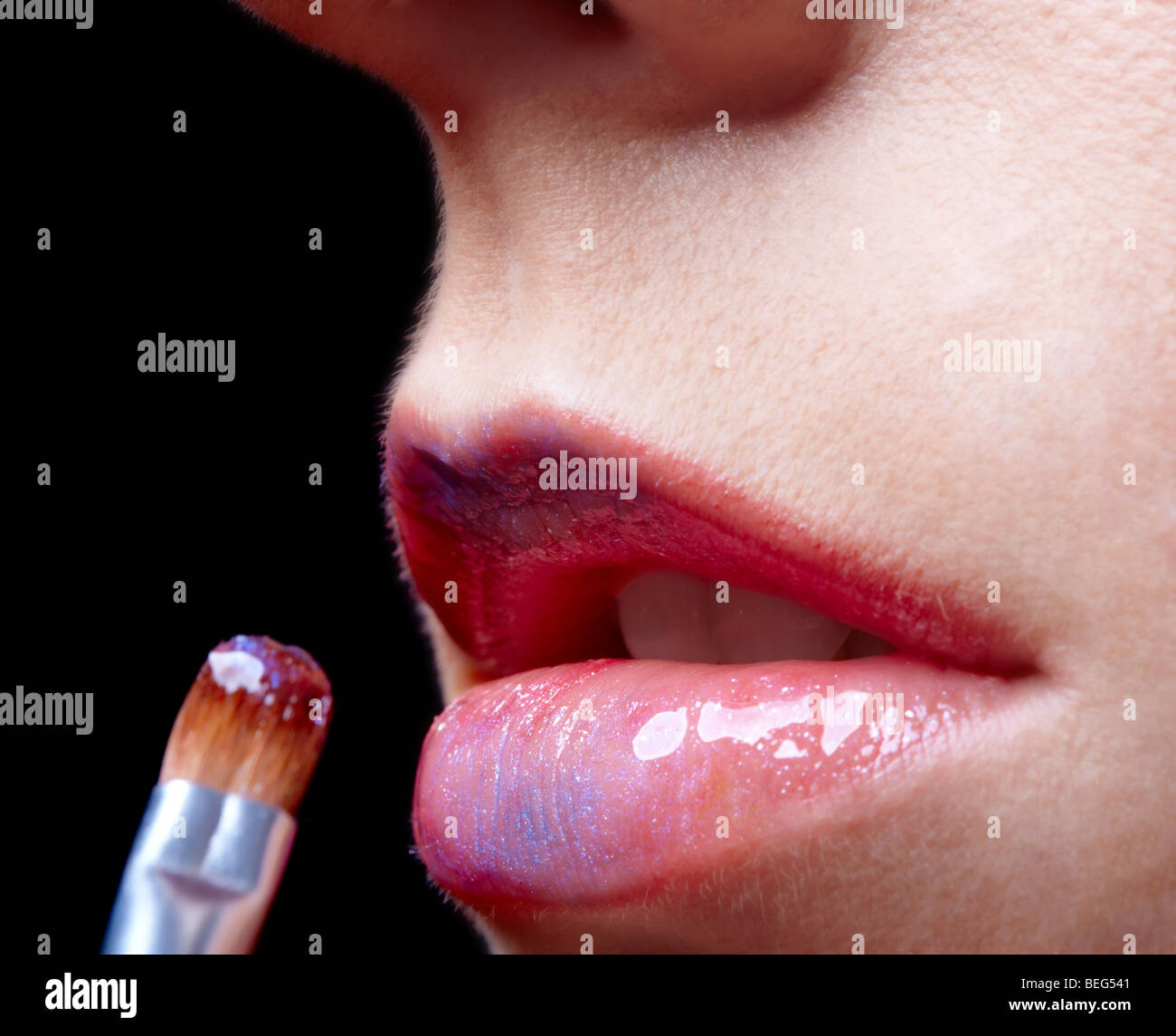 close up portrait of european girl's lips make up in process Stock ...