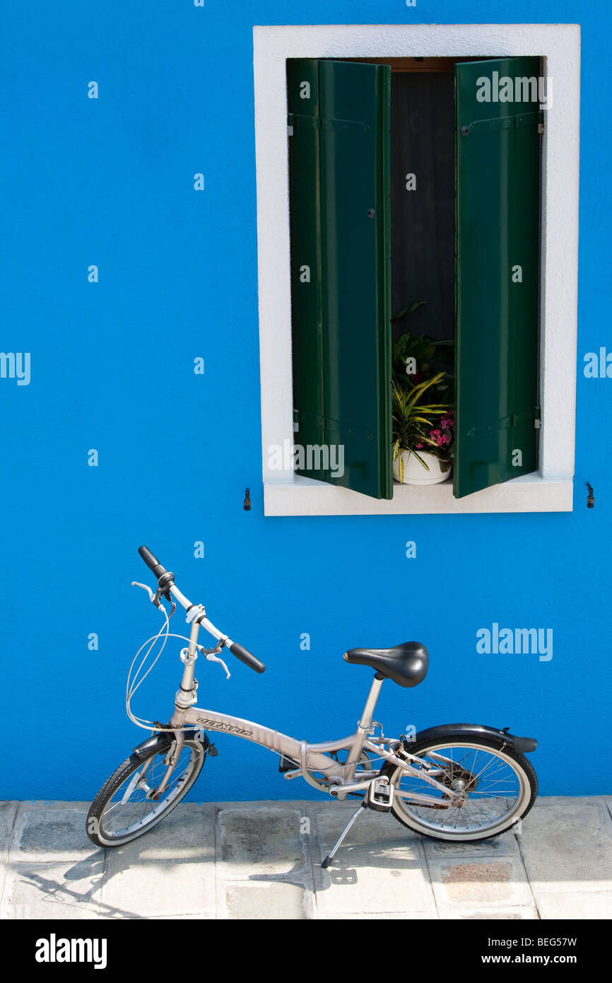 Bike in front of a window outside a house Stock Photo - Alamy