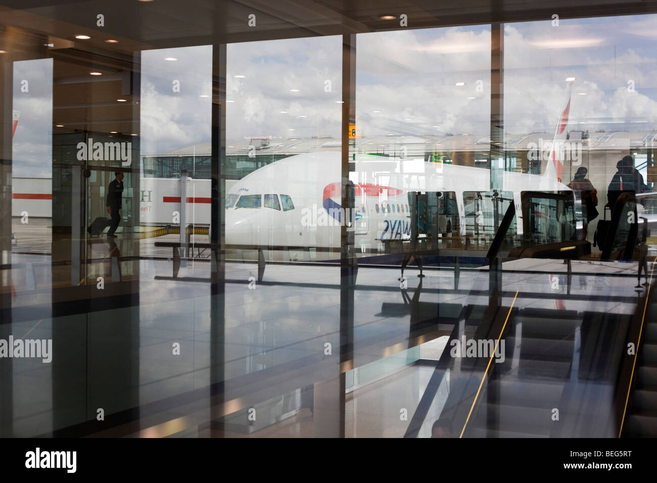 Arriving passengers, British Airways aircraft and airport architecture ...