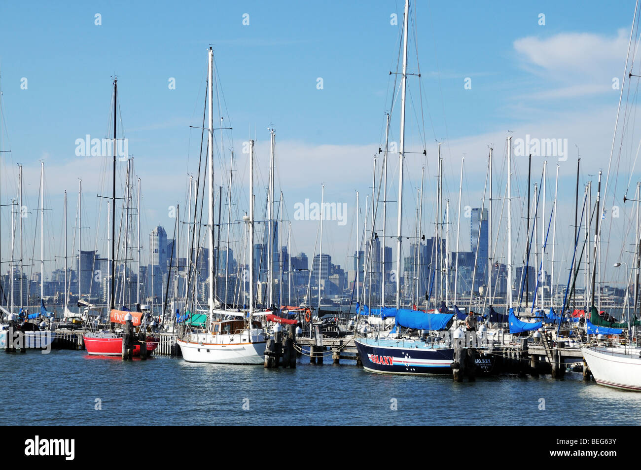 Boats yachts masts and Melbournes high rise skyscraper skyline from ...
