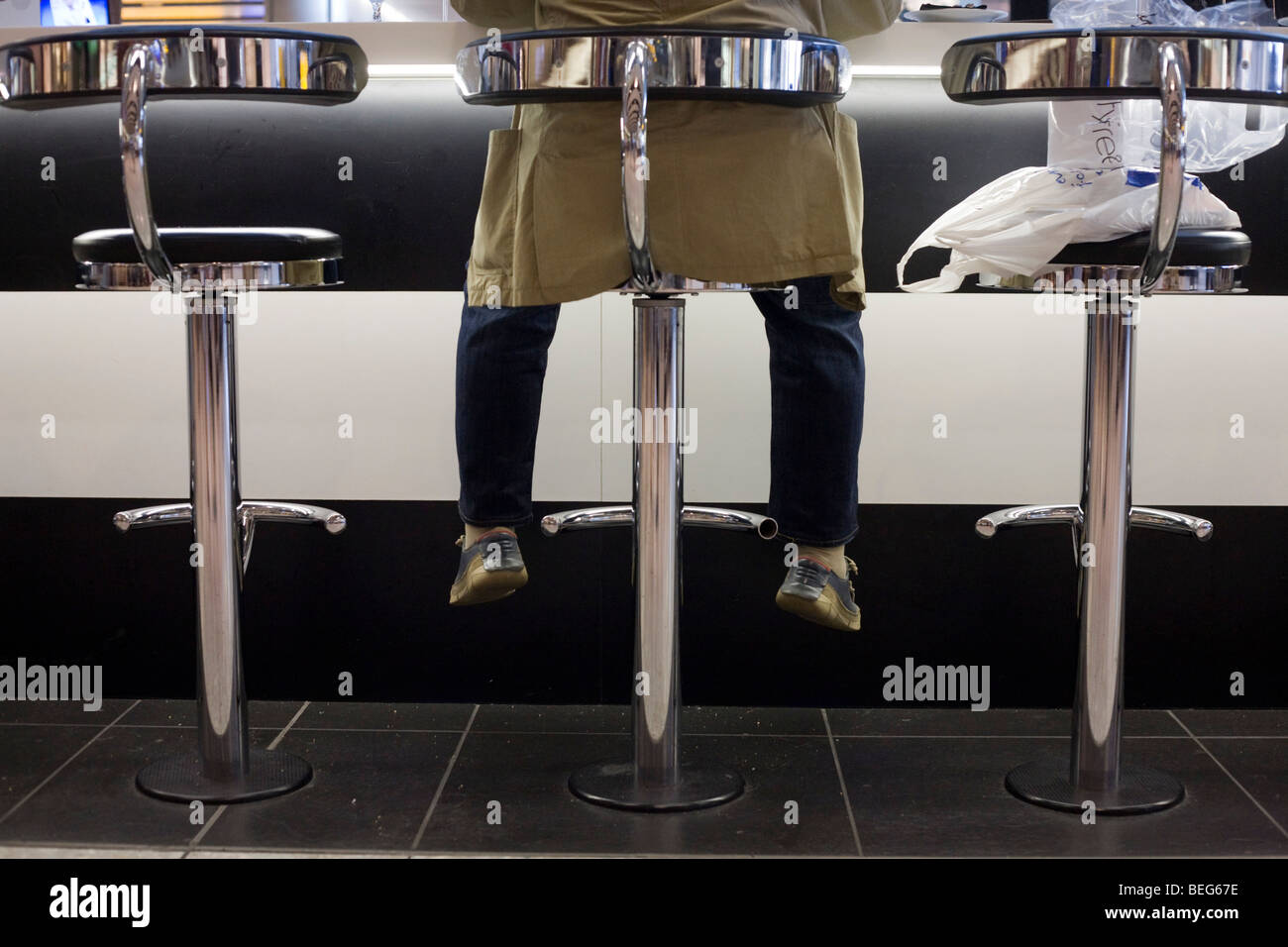 Male customer's legs dangling at Luxury caviar and assorted seafood ...