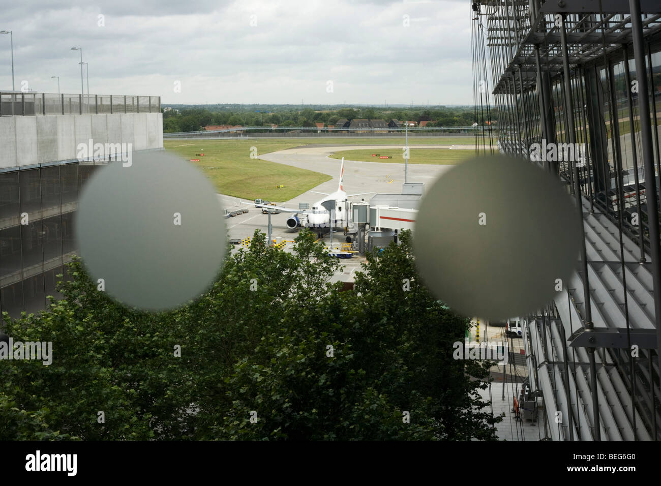 A parked British Airways aircraft is seen through the window at ...