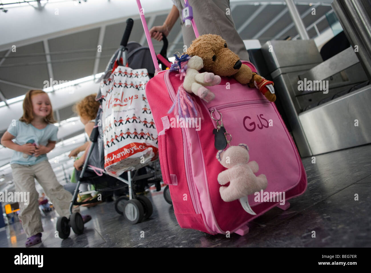 Children experiencing pre-holiday excitement in BA check-in areas at ...