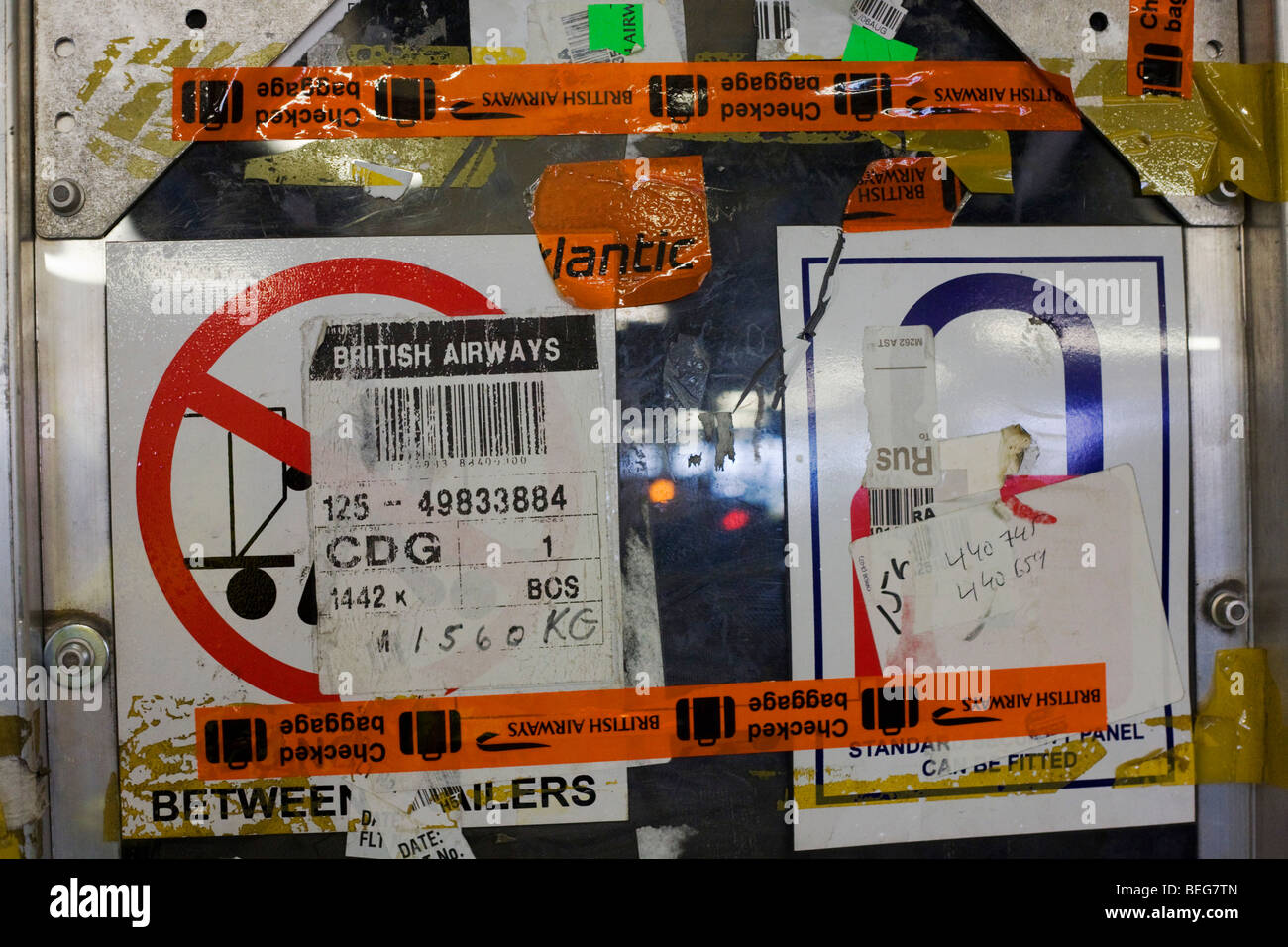 Close-up detail of stickers and dents of a airline baggage container ...