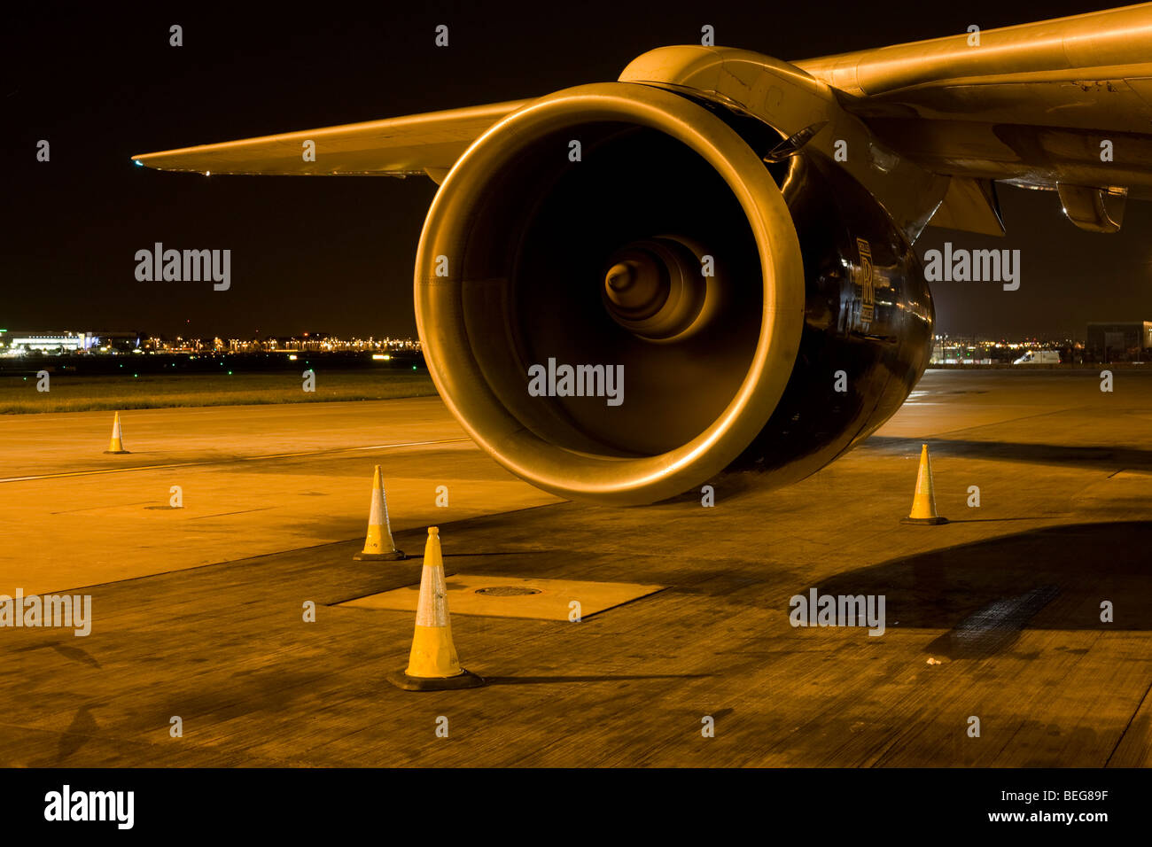 Traffic cones guard against night time accidents under a Boeing engine ...