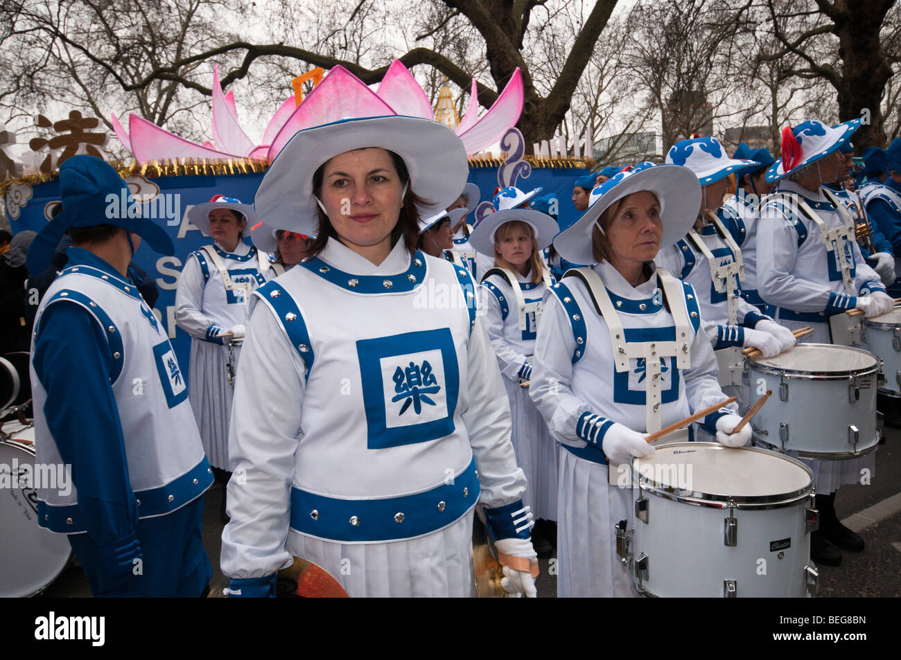 Drummers in white and blue costumes in Falun Dafa marching band, London ...