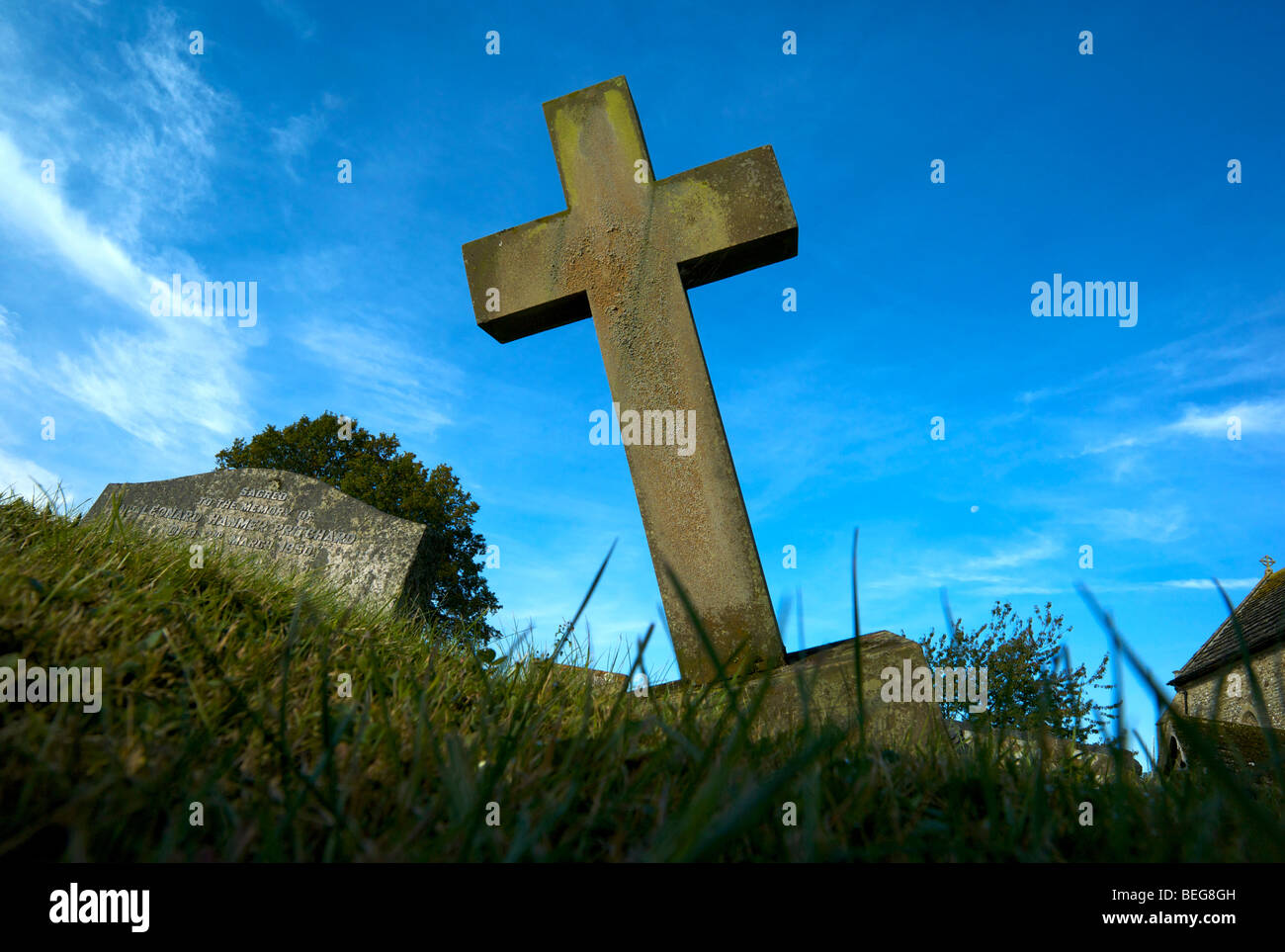 A leaning cross in a graveyard Stock Photo - Alamy