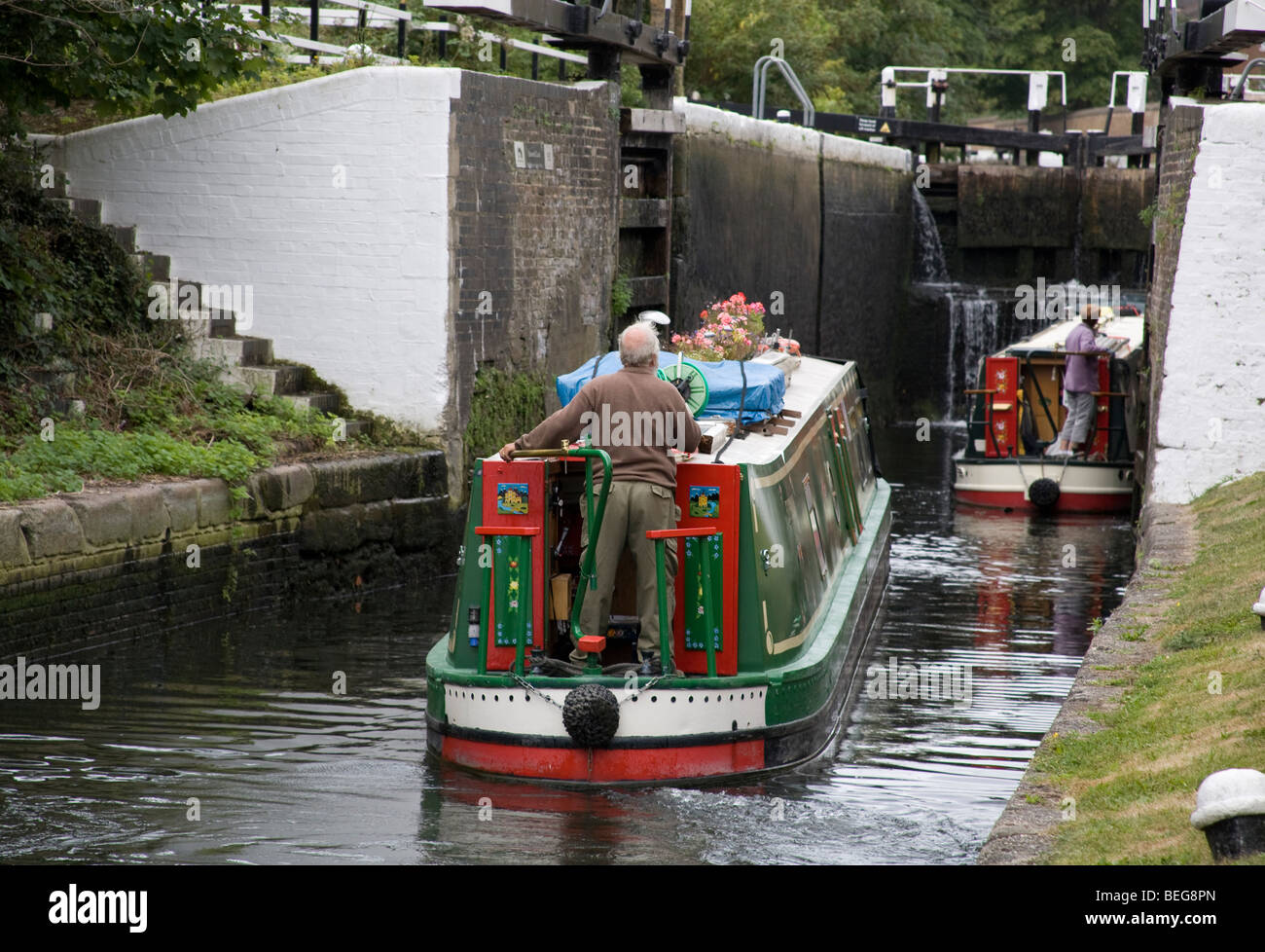 Barge going through a lock gate on the Grand Union Canal, Norwood Green ...