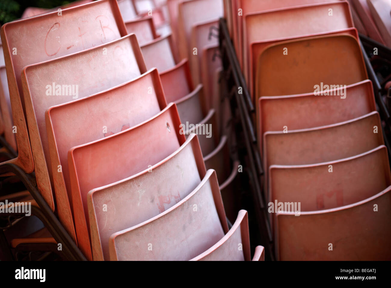A stack of pink plastic chairs Stock Photo - Alamy