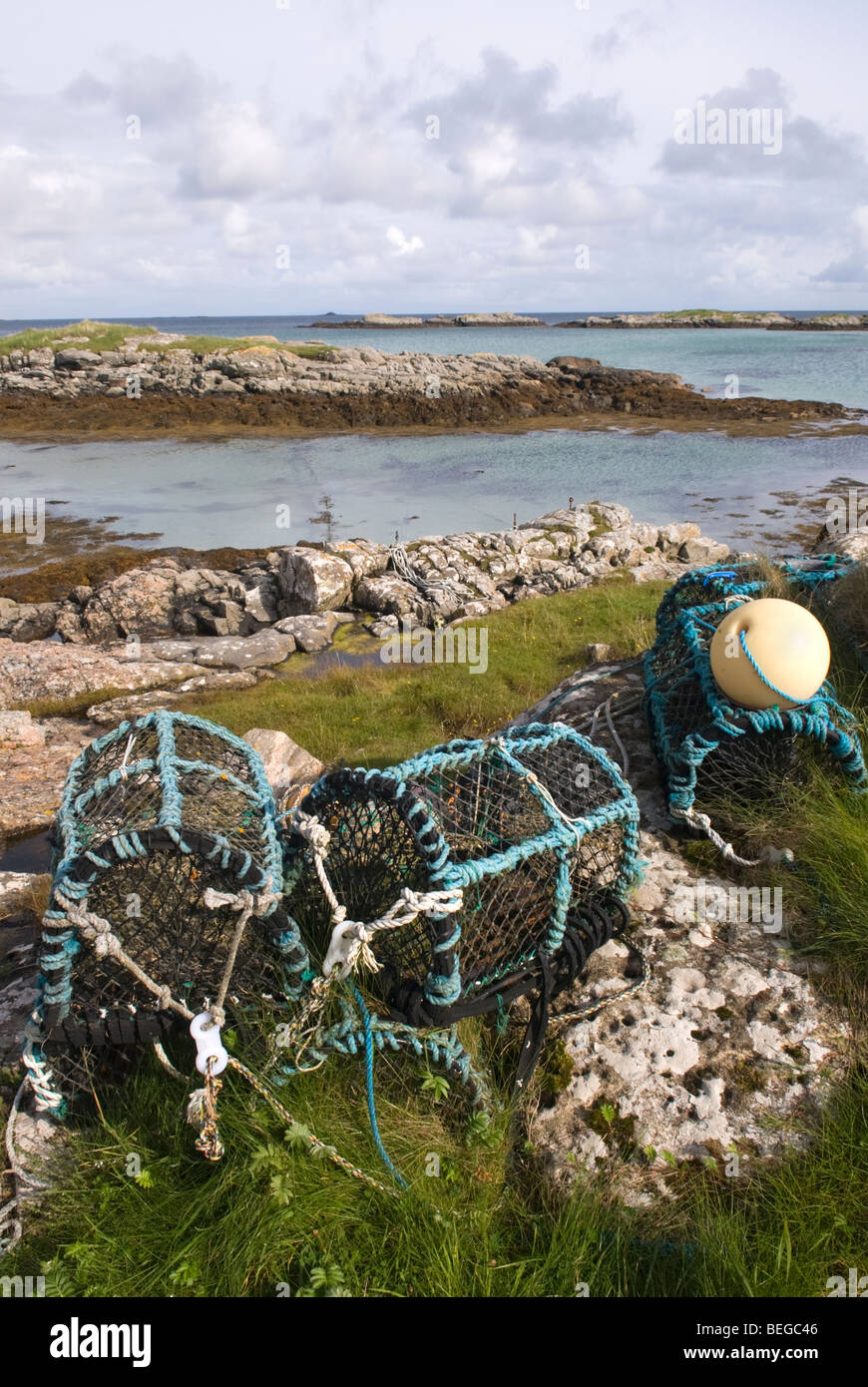 Lobster creels on the rocky coast at Earsairidh, the Isle of Barra ...