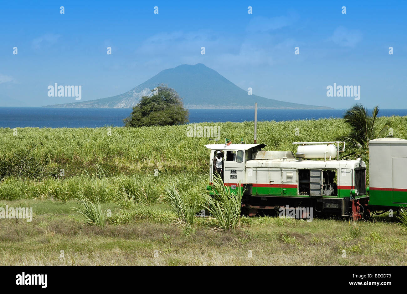 St. Kitts touristic sugar train with Saba island across the sea Stock ...