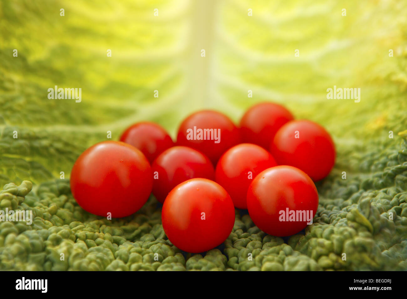 Raw vegetables still with cherry tomatoes and cabbage leaf Stock Photo ...