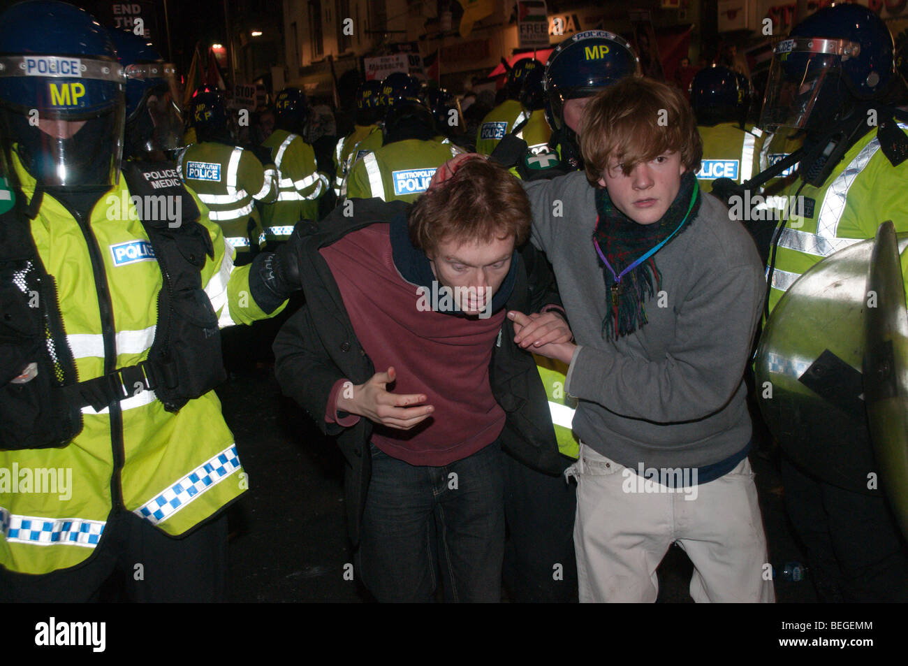 Police in riot gear & injured man at demonstration at Israeli Embassy ...