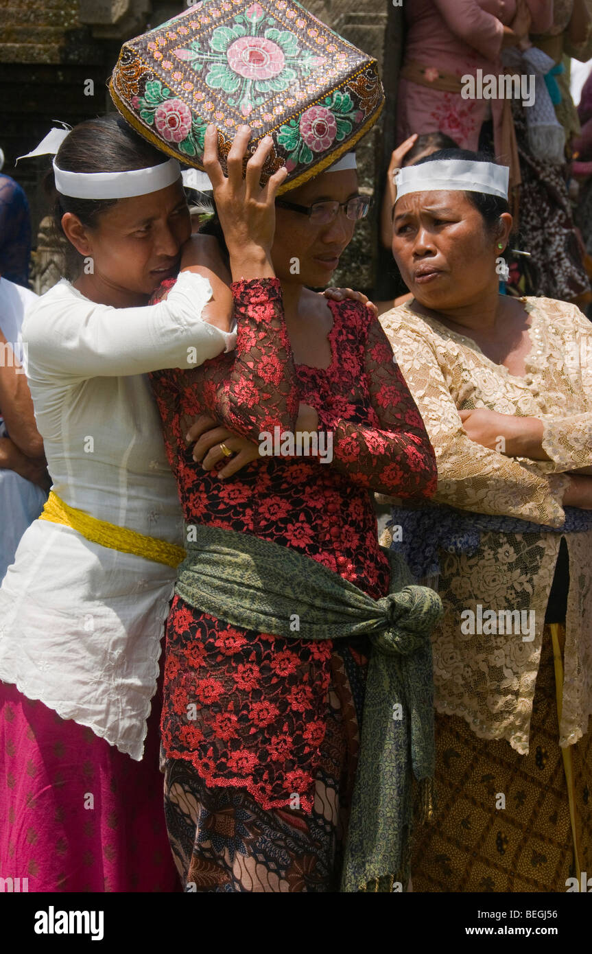 women grieving at a traditional funeral and cremation ceremony in Ubud ...
