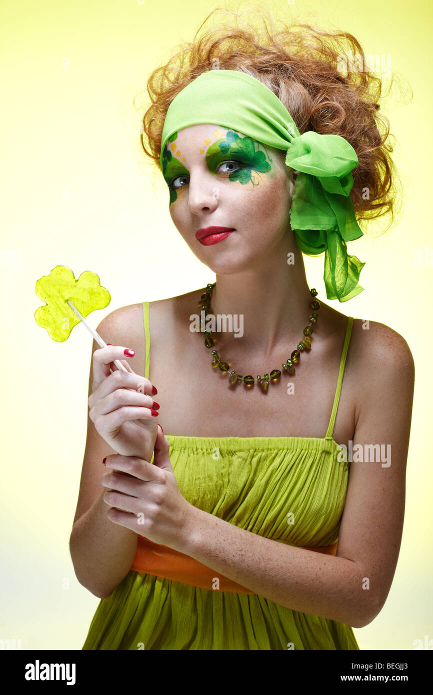 portrait of beautiful red-haired model with shamrock body art Stock ...