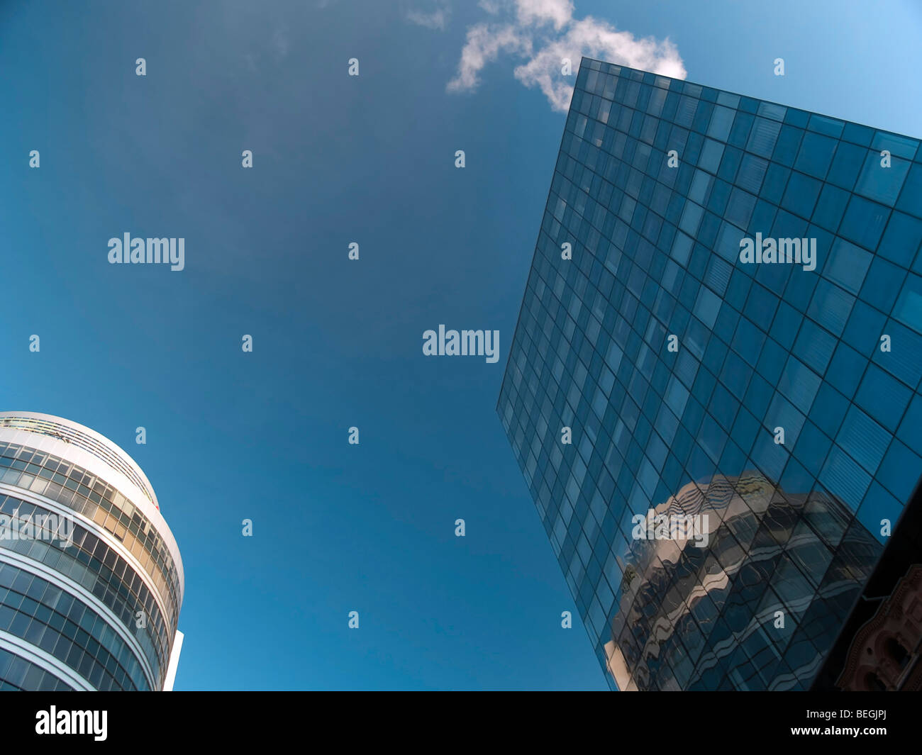 Two skyscrapers low-angle view and blue sky Stock Photo - Alamy