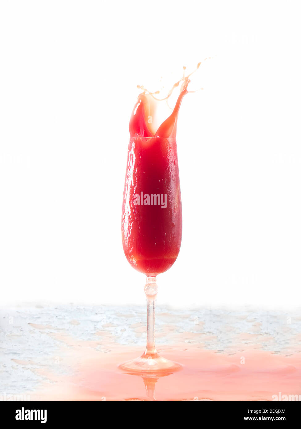 Tomato juice splash in glass white background Stock Photo - Alamy