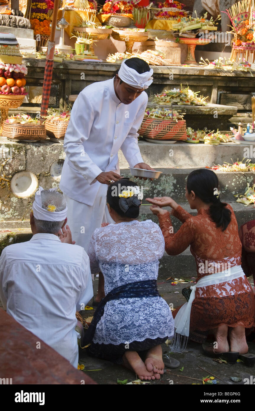 praying at temple during a local festival in Bali Indonesia Stock Photo ...