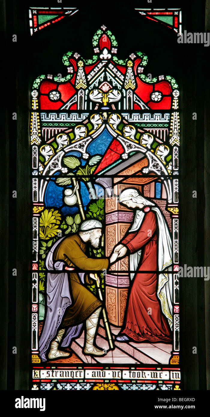 A stained glass window depicting a corporal act of mercy (house the ...
