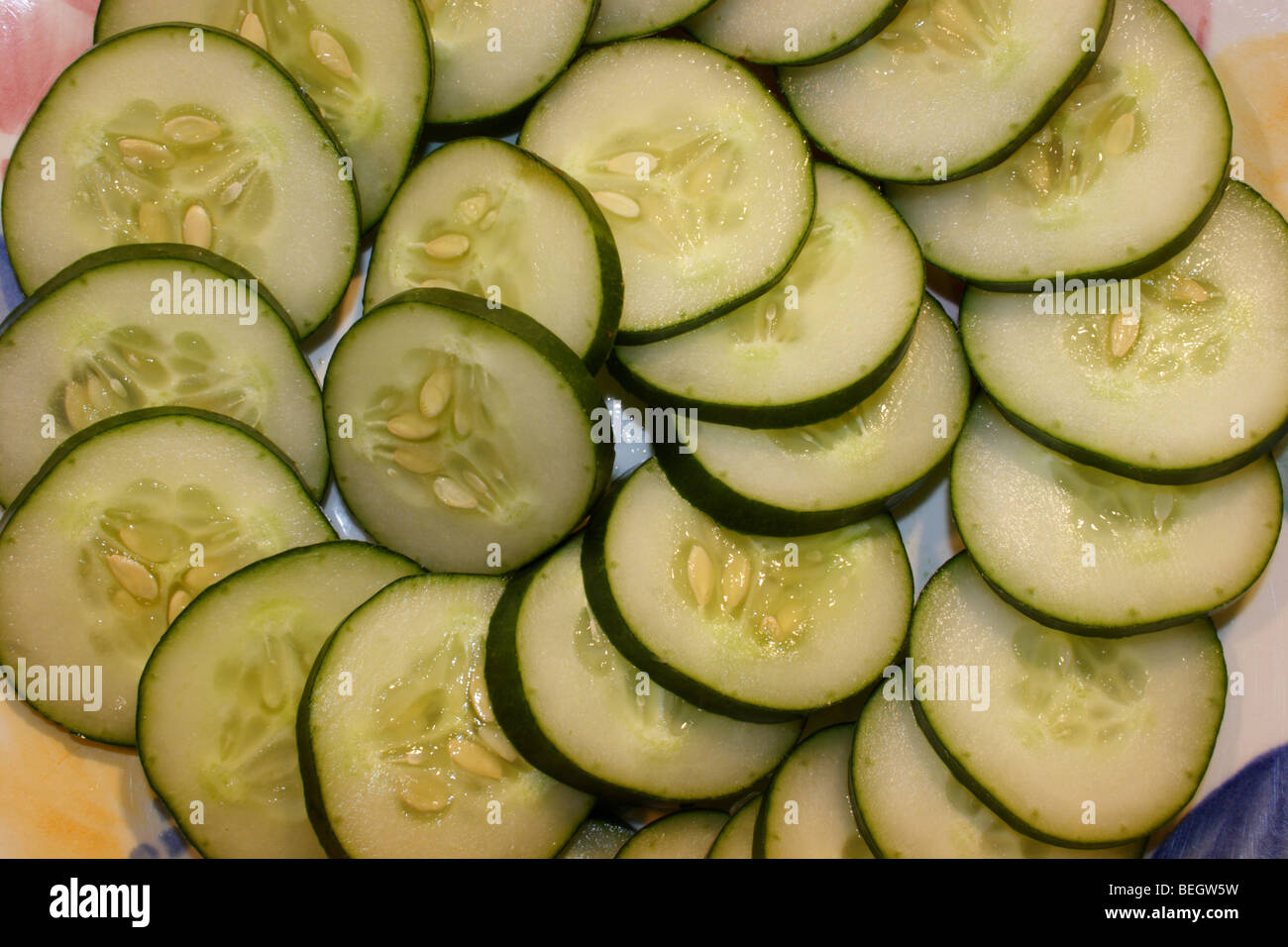 Cucumber slices on dinner plate Stock Photo - Alamy
