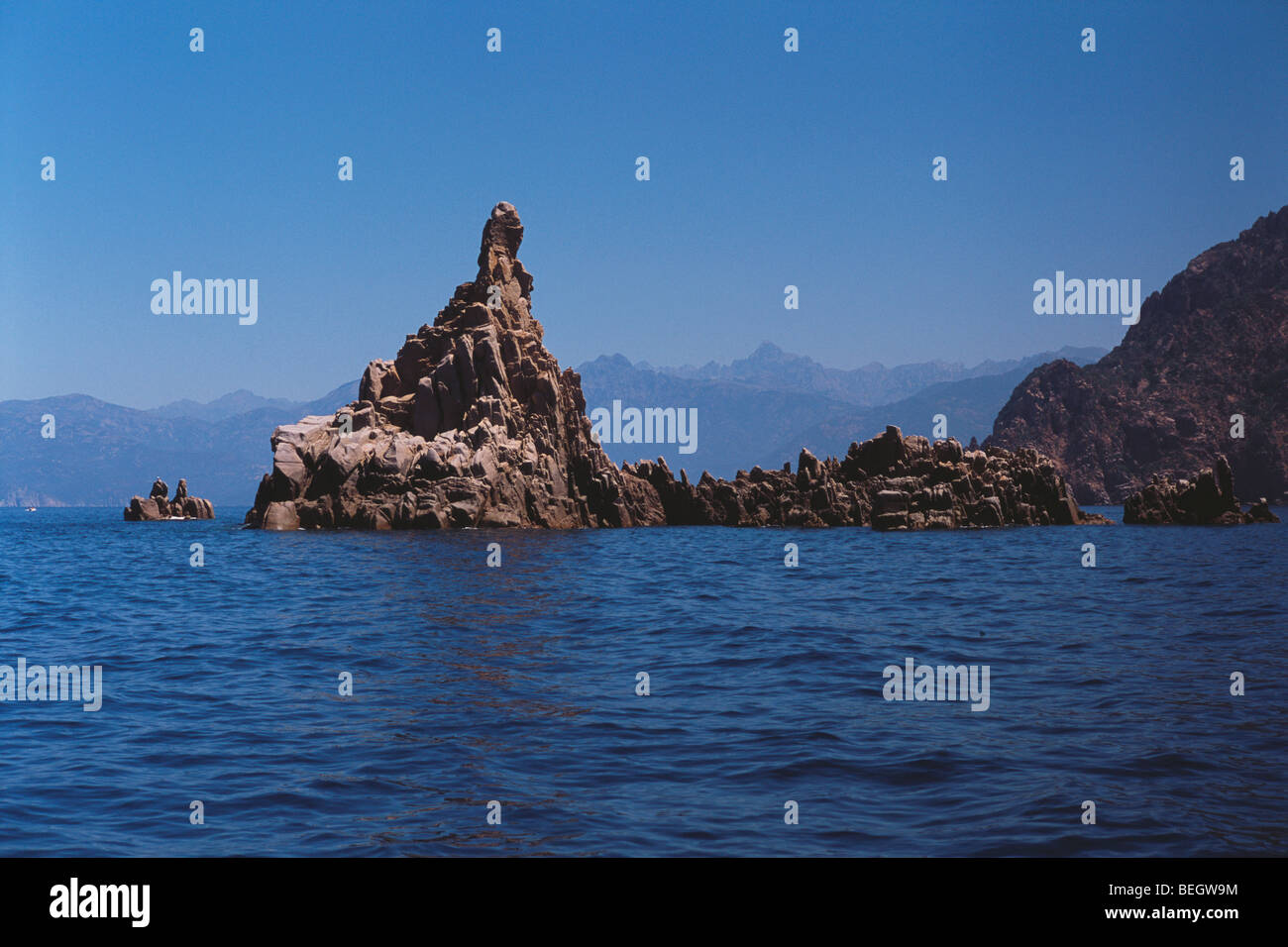 Rock formation near Capo Rosso Gulf de Porto Corsica- Mt Cinto in ...