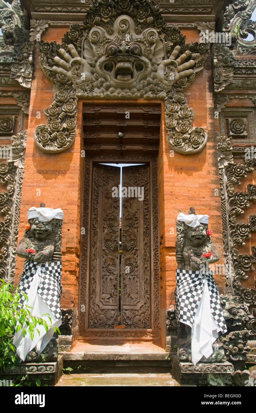 artistic crafted temple doors and statues in Bali Indonesia Stock Photo ...
