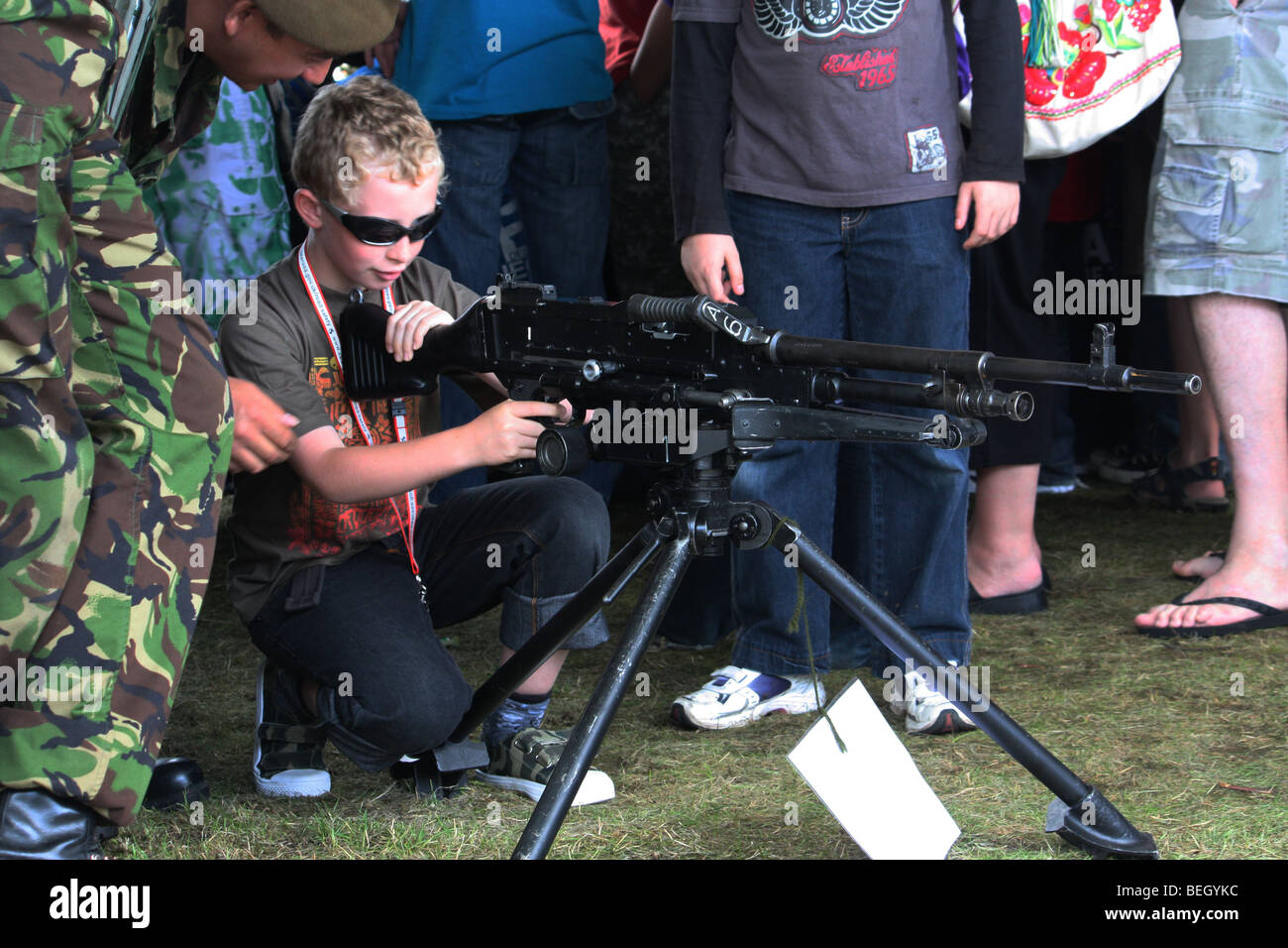 A young lad with a big gun Stock Photo - Alamy