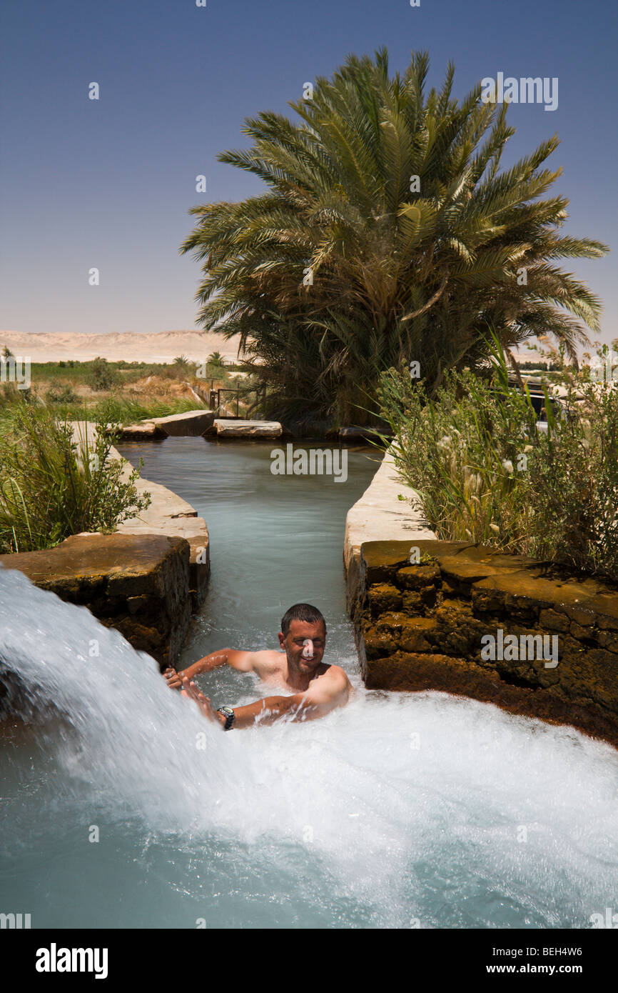 Tourist bathing in Hot Spring of Farfra Oasis, Libyan Desert, Egypt ...