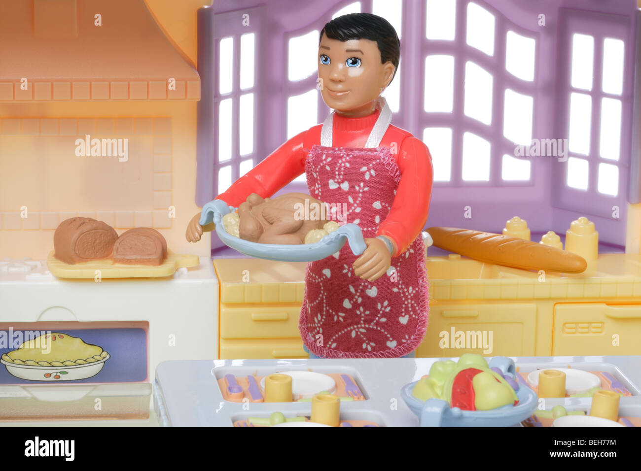Father doll cooking in the kitchen Stock Photo - Alamy