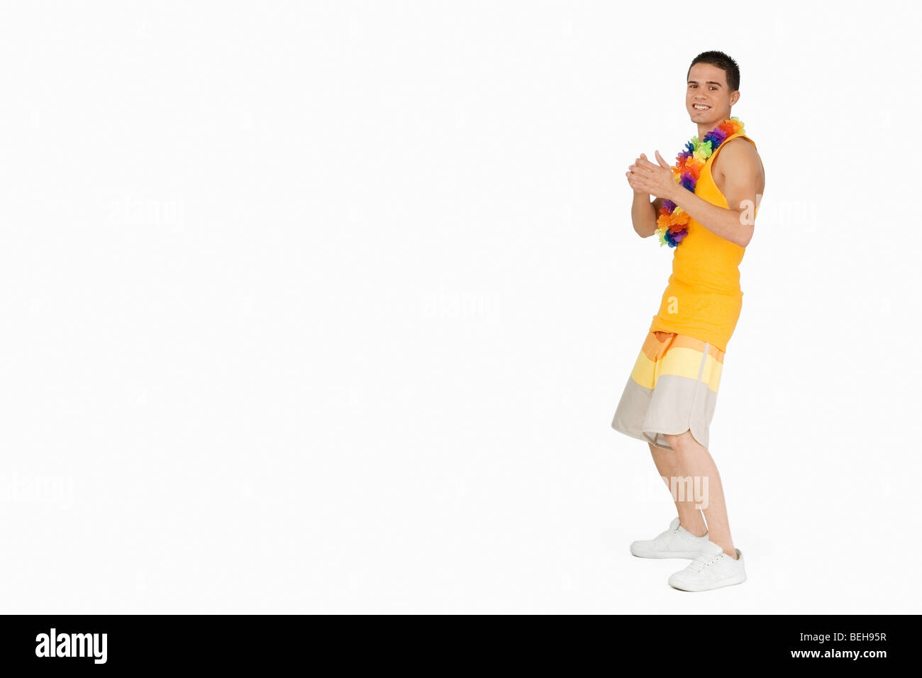 Side profile of a young man clapping Stock Photo - Alamy