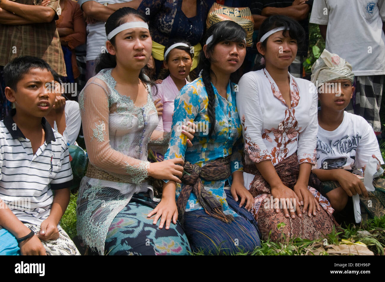 girls grieving at a traditional funeral and cremation ceremony in Ubud ...