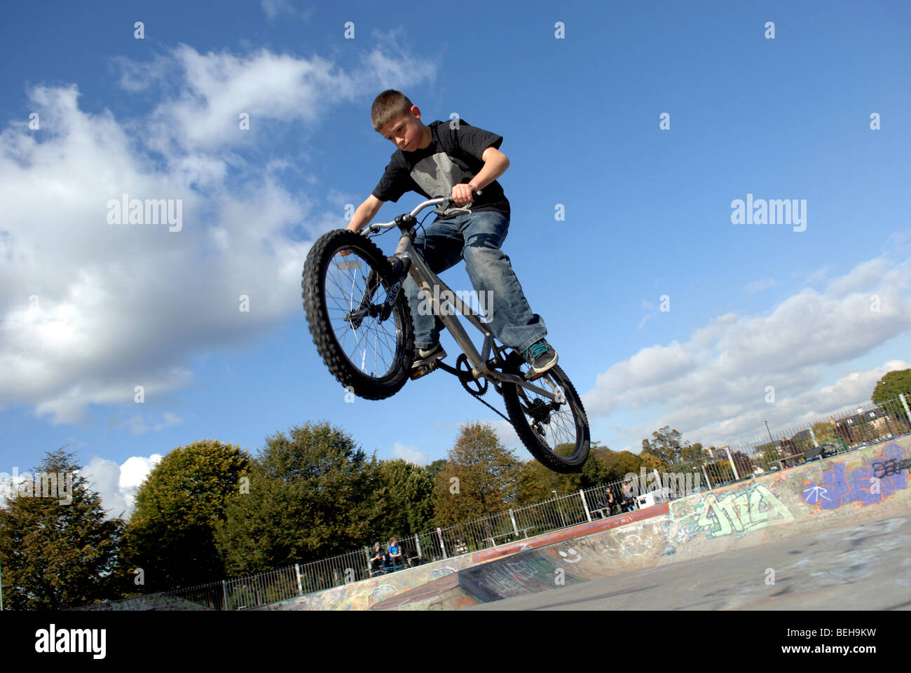 Kids playing in a skatepark Stock Photo - Alamy