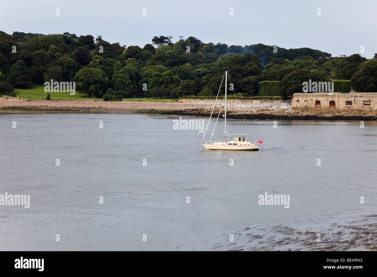 A Yacht leaves Plymouth, passing the Blockhouse opposite Devil's Point ...