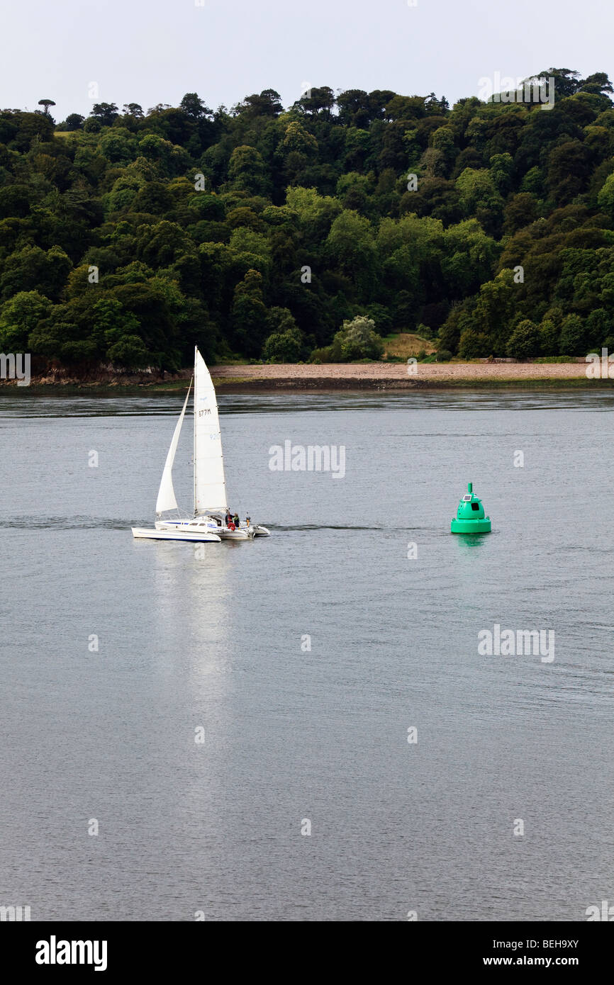 A trimaran Yacht leaves Plymouth, passing Devil's Point, Devon, UK ...