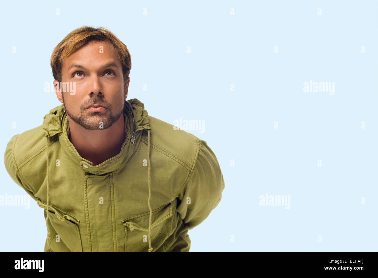 Close-up of a mid adult man bending forward Stock Photo - Alamy