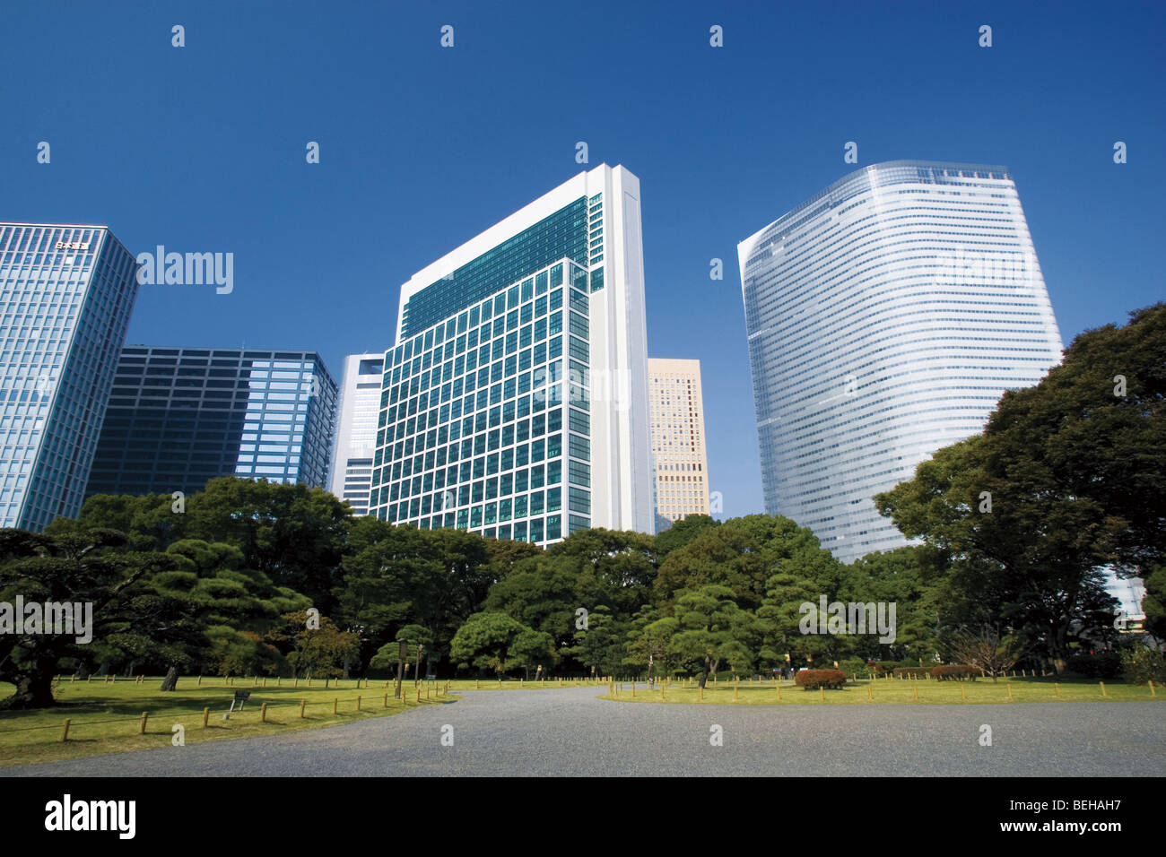 A garden and the Shiodome building group in Minato, Tokyo, Japan Stock ...
