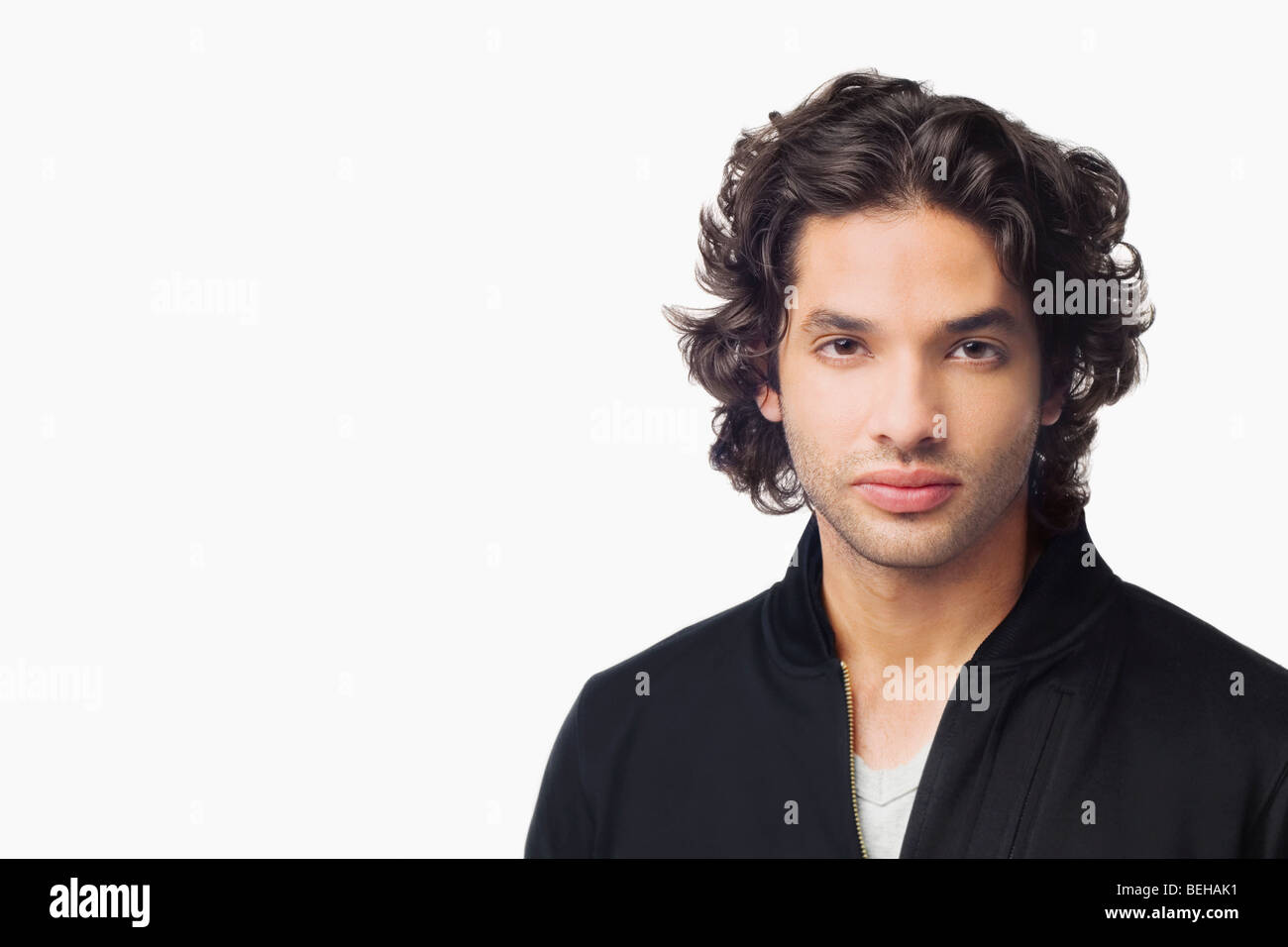 Portrait of a young man thinking Stock Photo - Alamy