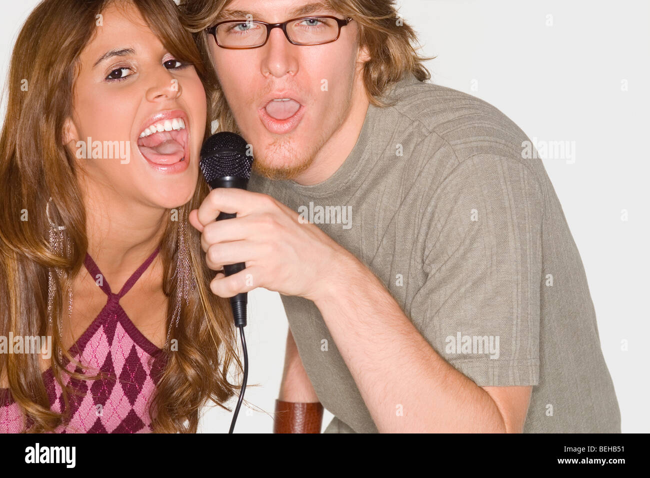 Portrait of a young couple singing together Stock Photo - Alamy
