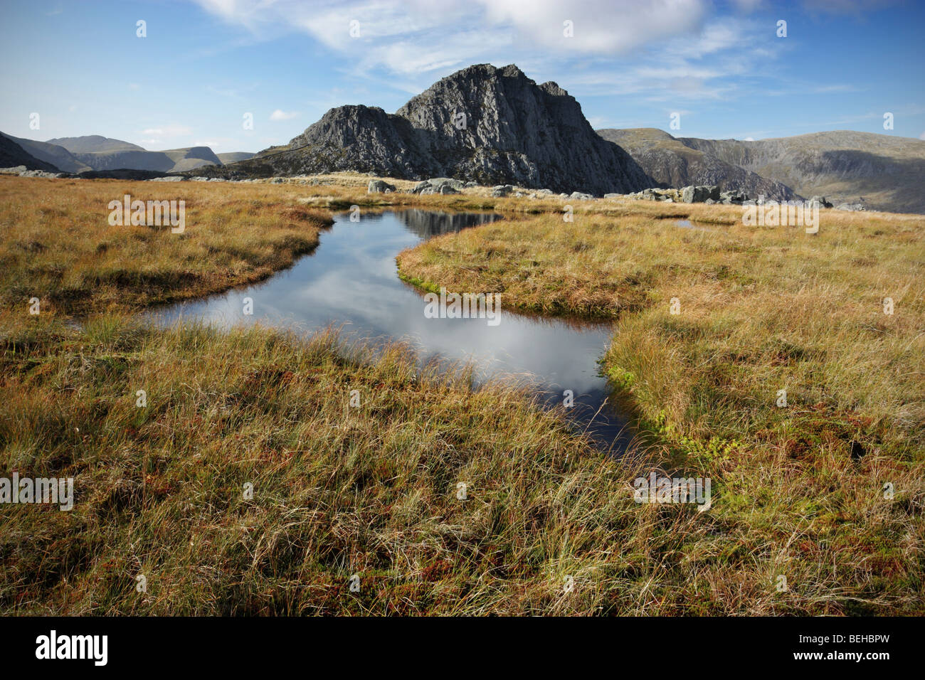 The mountain of Tryfan, viewed across the lake of Llyn Caseg-fraith in ...