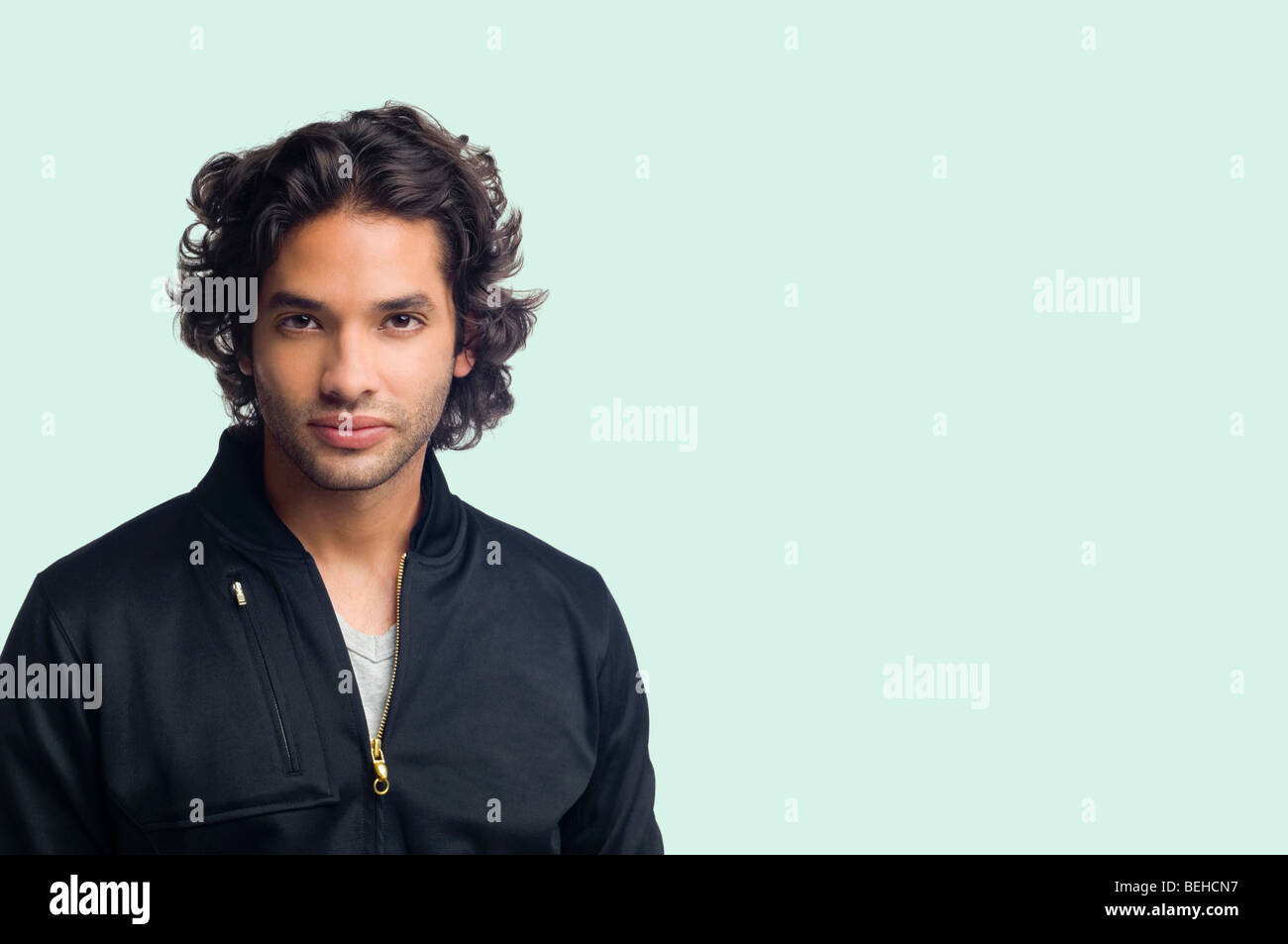 Portrait of a young man thinking Stock Photo - Alamy