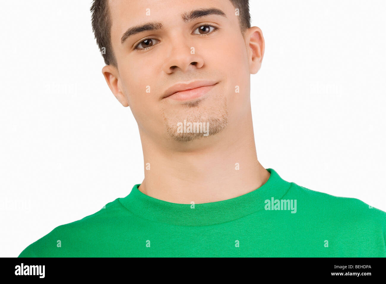 Portrait of a young man smirking Stock Photo - Alamy