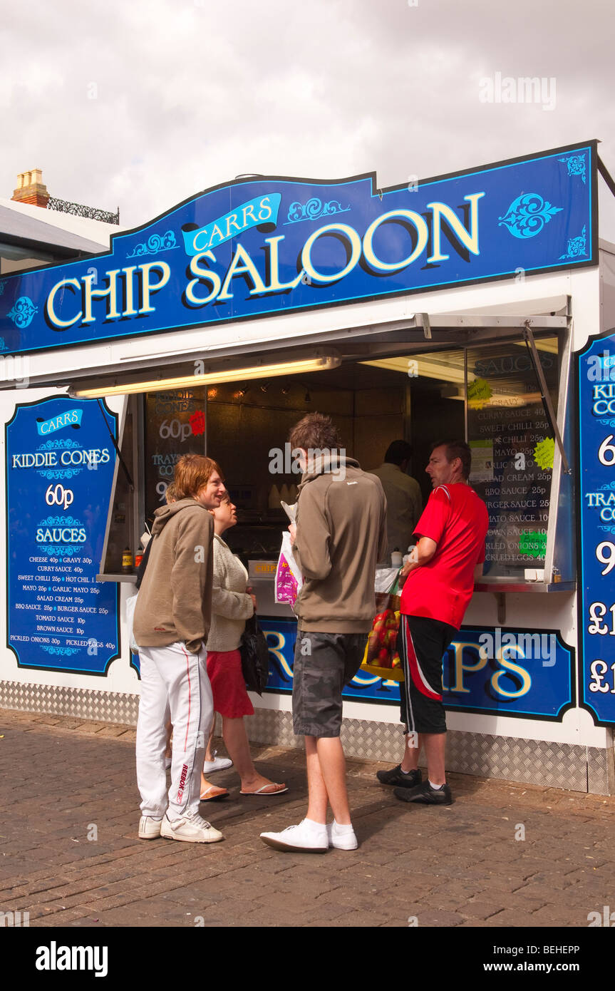 People eating chips from a chip stall ( carrs chip saloon ) at the ...
