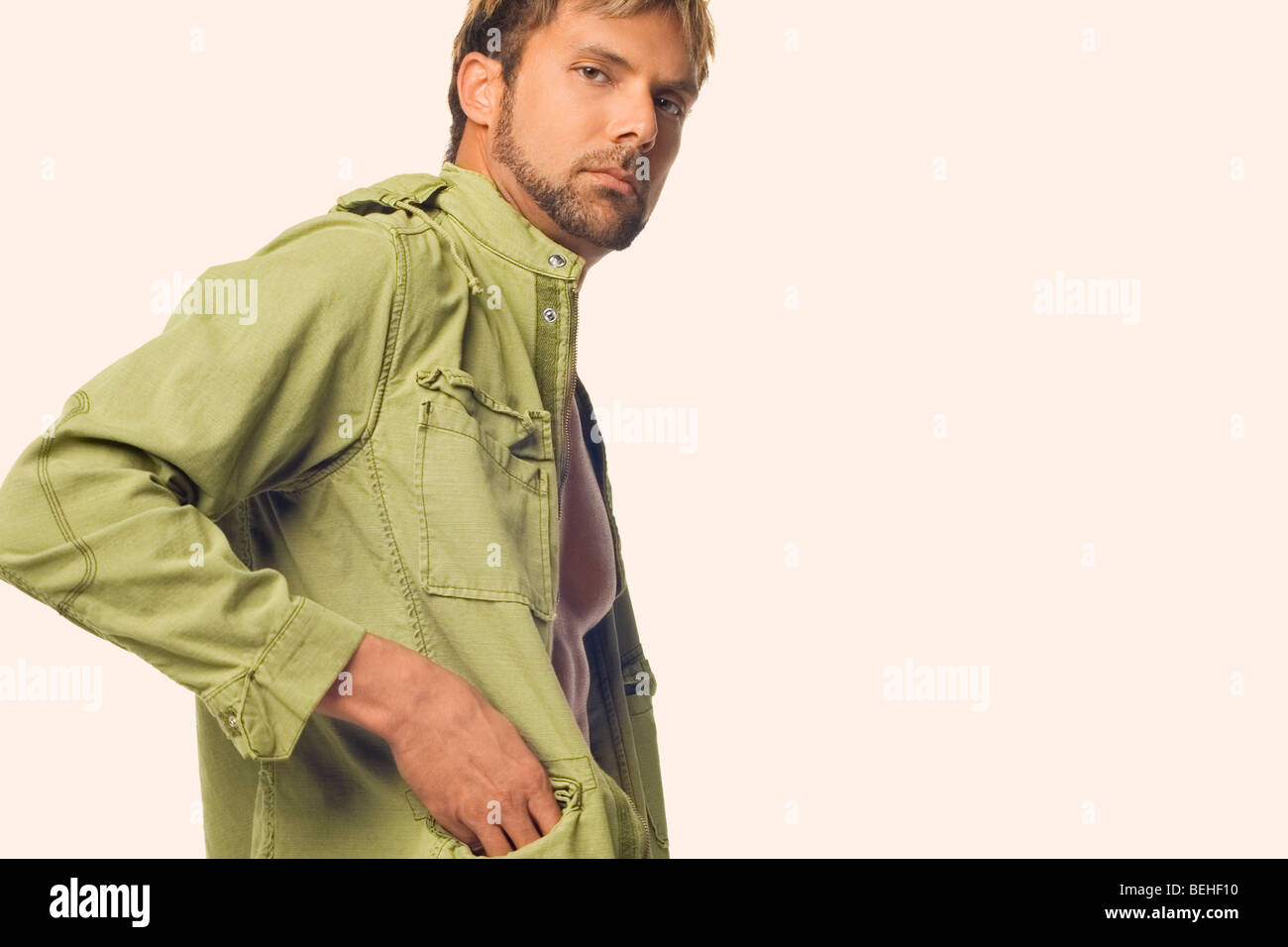 Portrait of a mid adult man standing with his one hand in his pocket ...