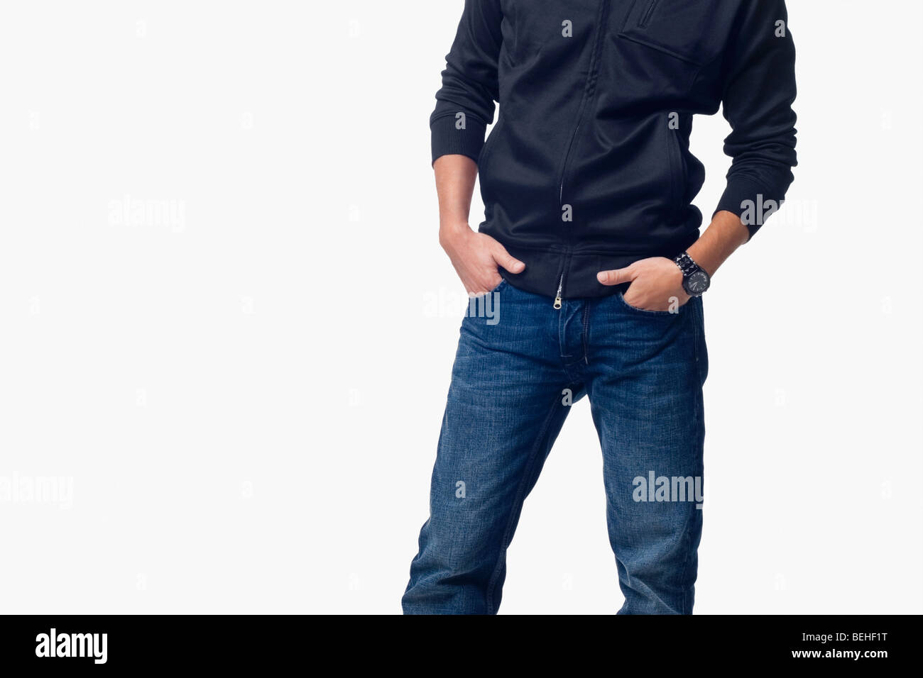 Young man standing with his hands in his pockets Cut Out Stock Images ...