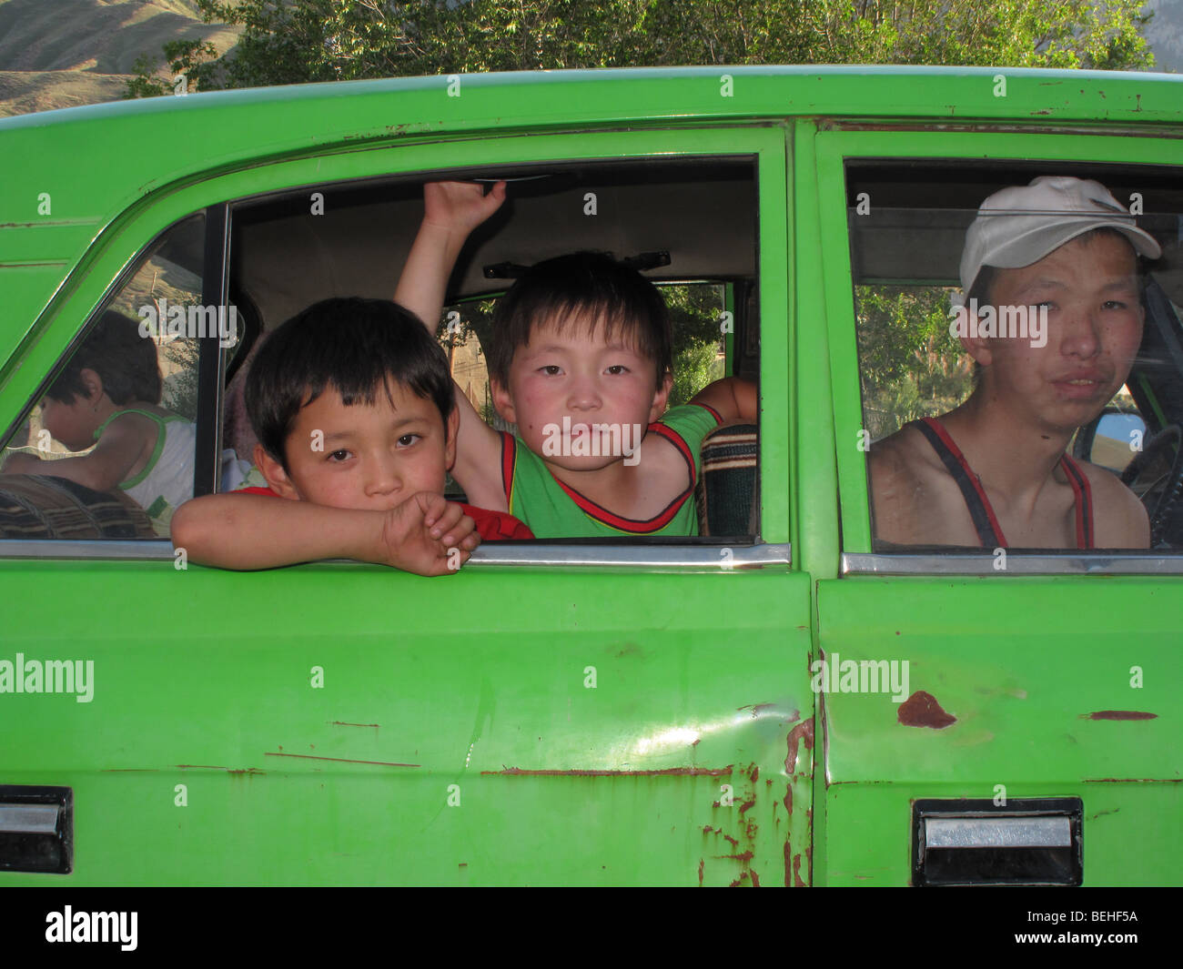 4 brothers sitting in their soviet era car in Naryn, Kyrgyzstan Stock ...